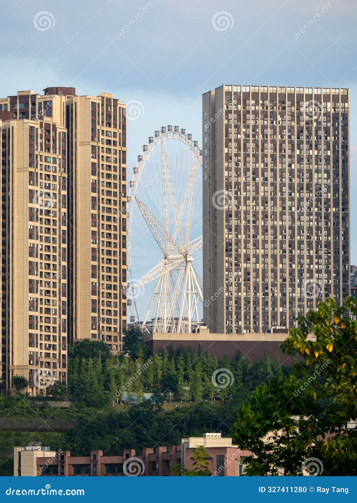 Ferris wheel and buildings stock photo. Image of engineering - 327411280