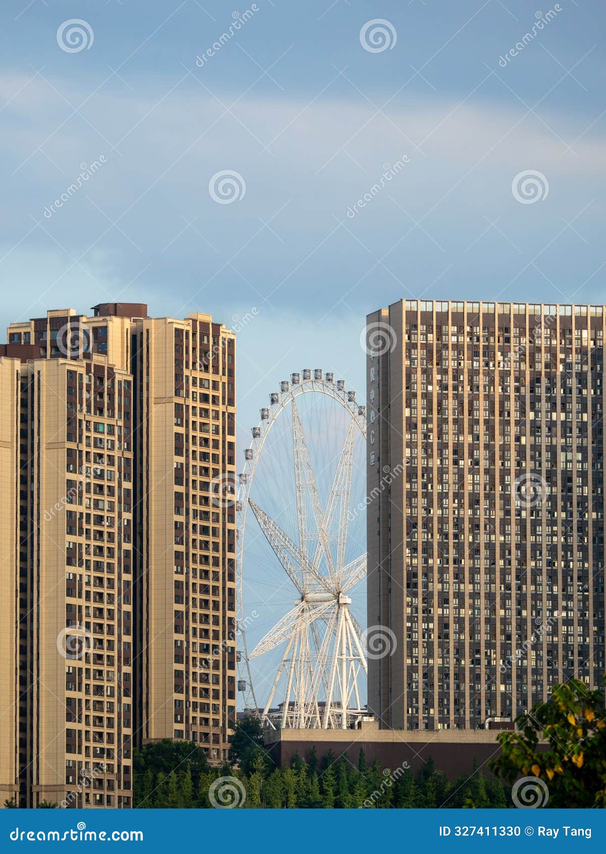 Ferris wheel and buildings stock photo. Image of engineering - 327411330
