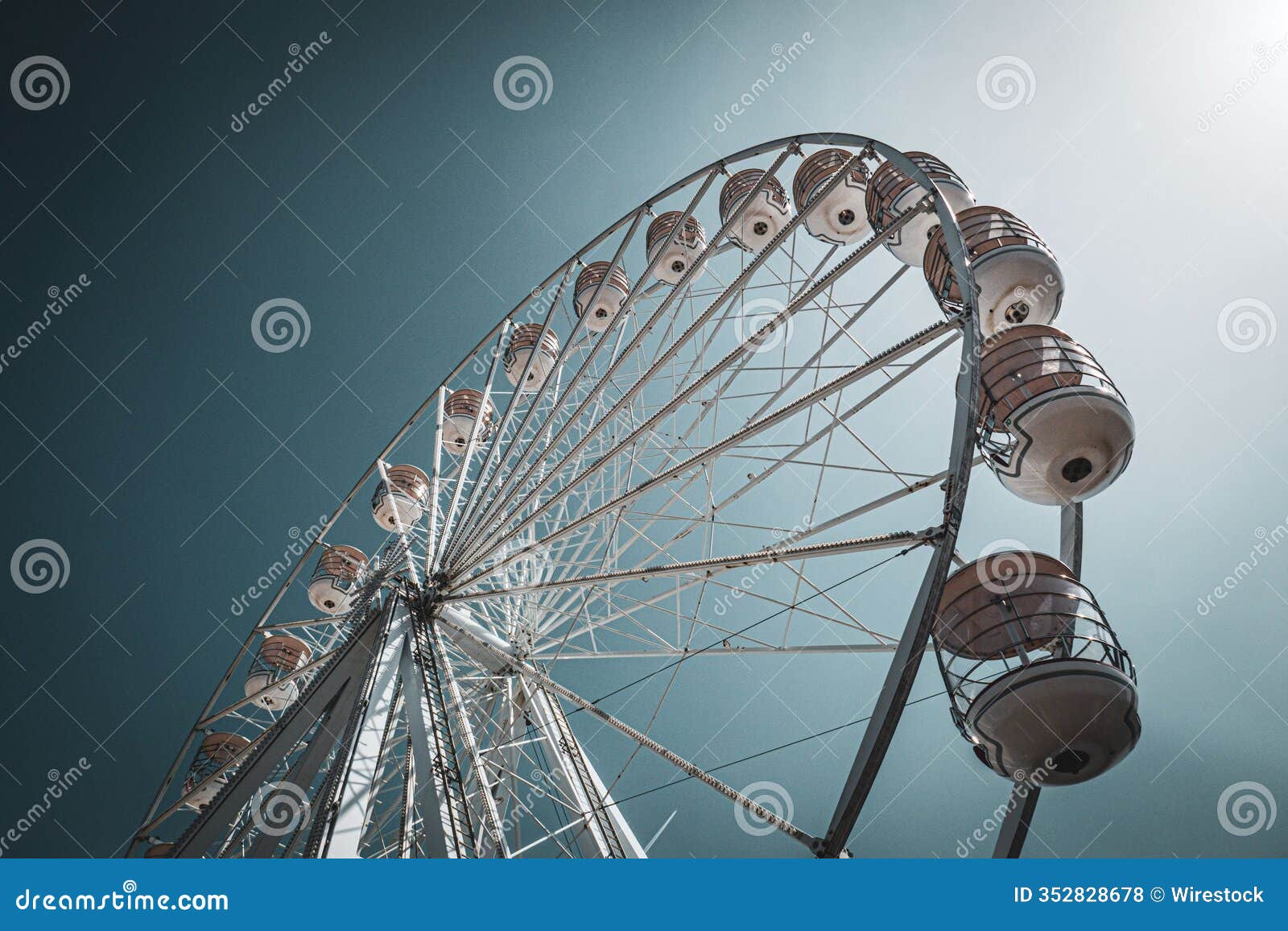 Ferris Wheels Cabins and Framework Dominate the Frame, Set Against a ...