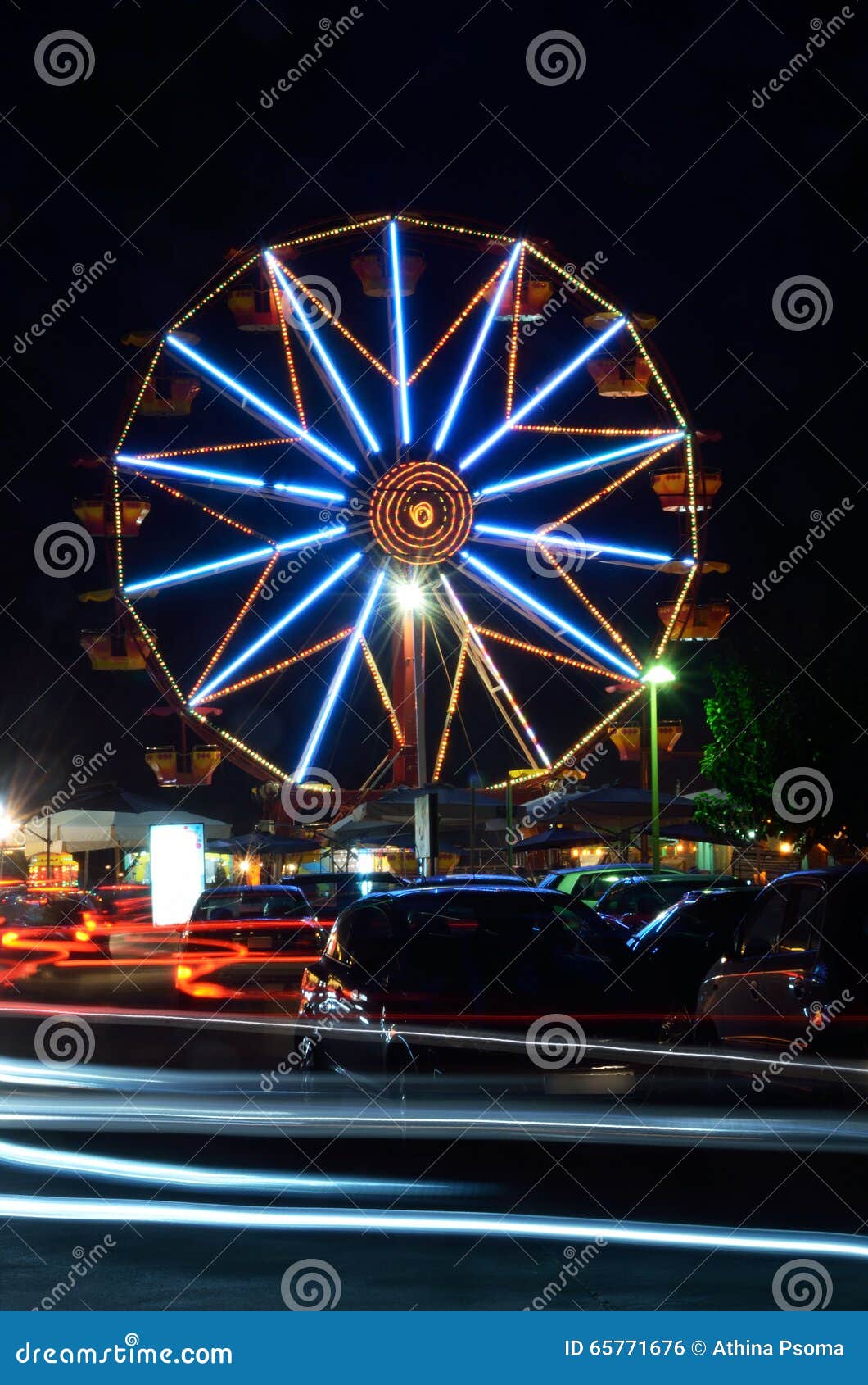 Ferris wheels at night stock photo. Image of abstract - 65771676