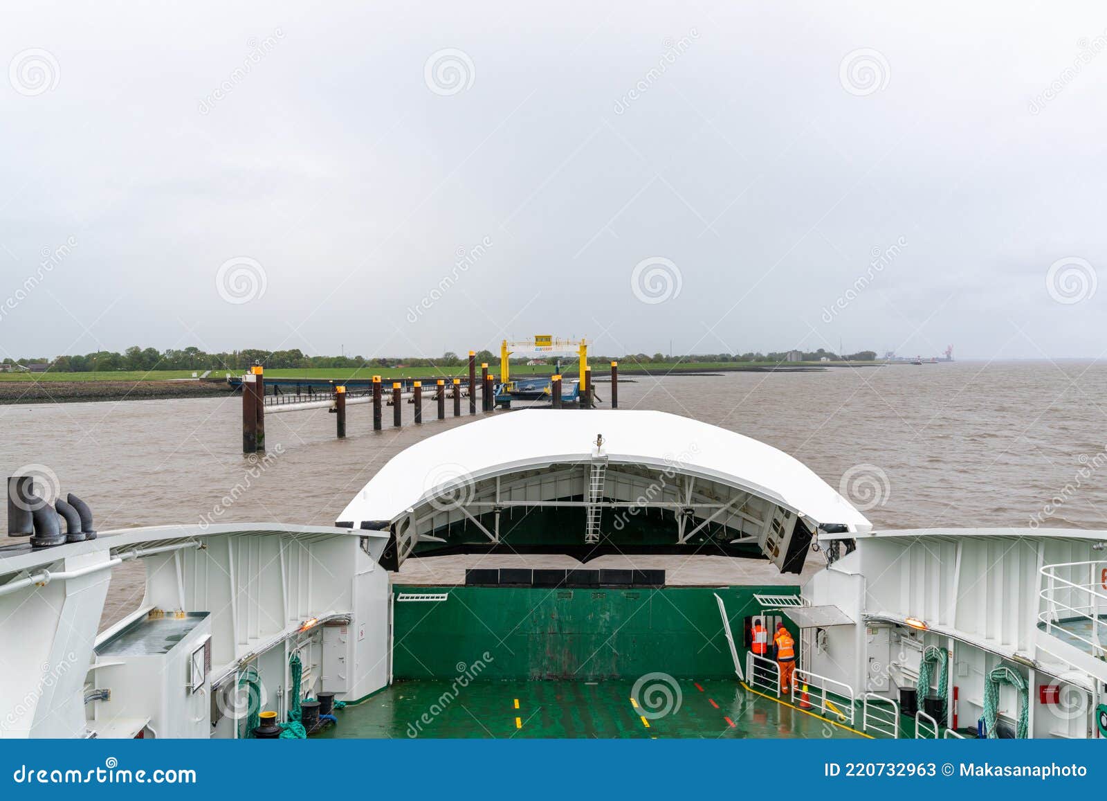 Ferry Crew Prepares To Dock at Harbor and Open Front End of Ferry for ...