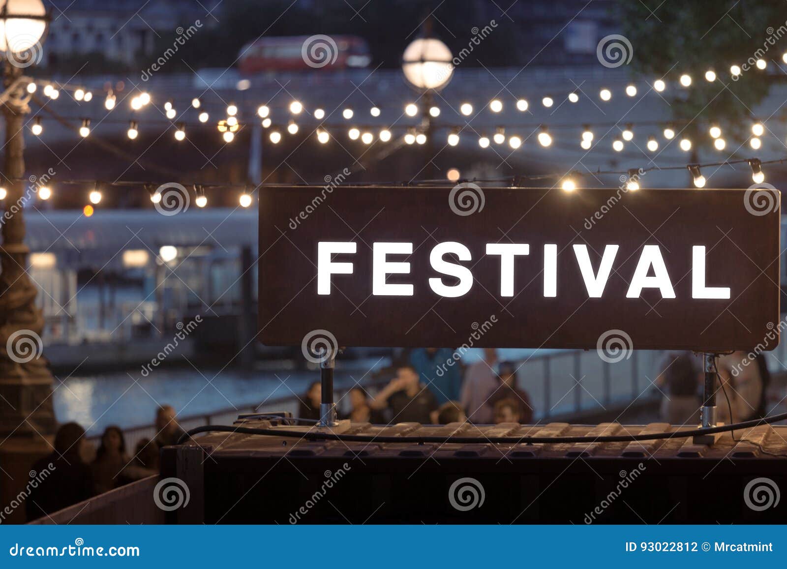 Festival Sign with Blurred String Lights in the Background Stock Photo ...