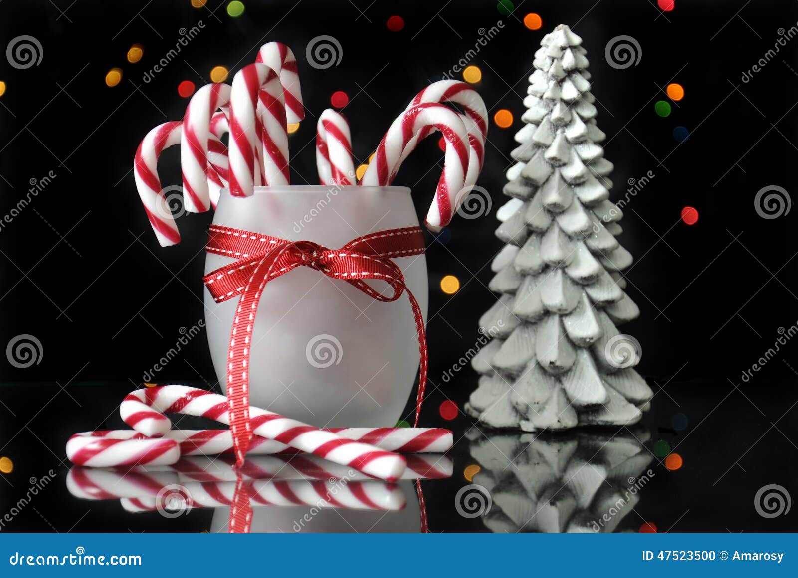 Festive Christmas Candy Canes and Trees on Reflective Table Stock Photo ...