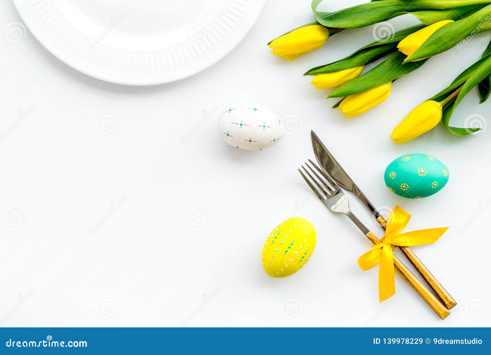 Festive Easter Table Decorated with Tulips. Tableware and Painted Eggs ...