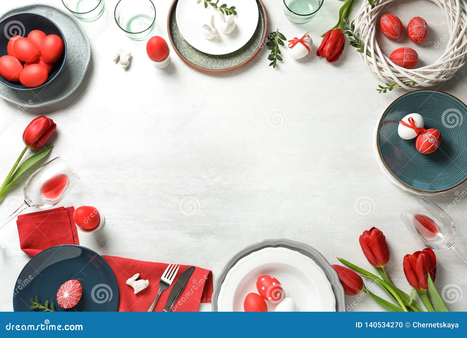 Festive Easter Table Setting with Painted Eggs on Wooden Background ...