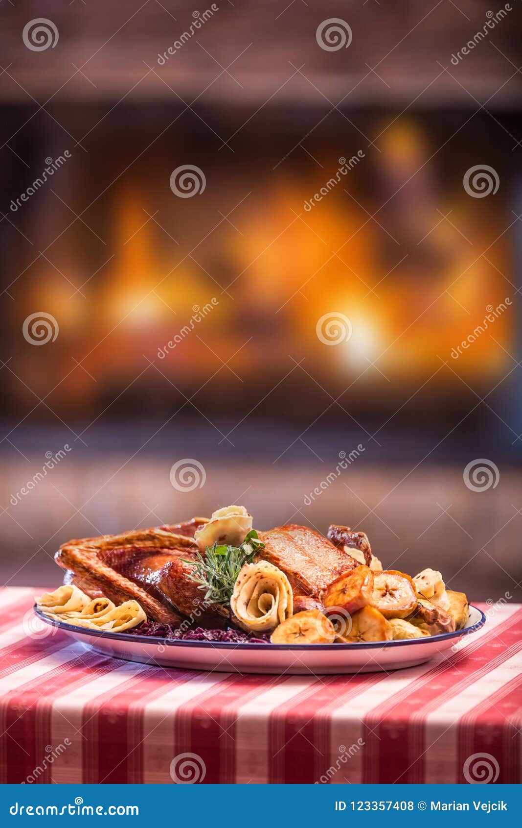 Festive Garnished Roast Duck with Apples and Red Cabbage Stock Photo ...
