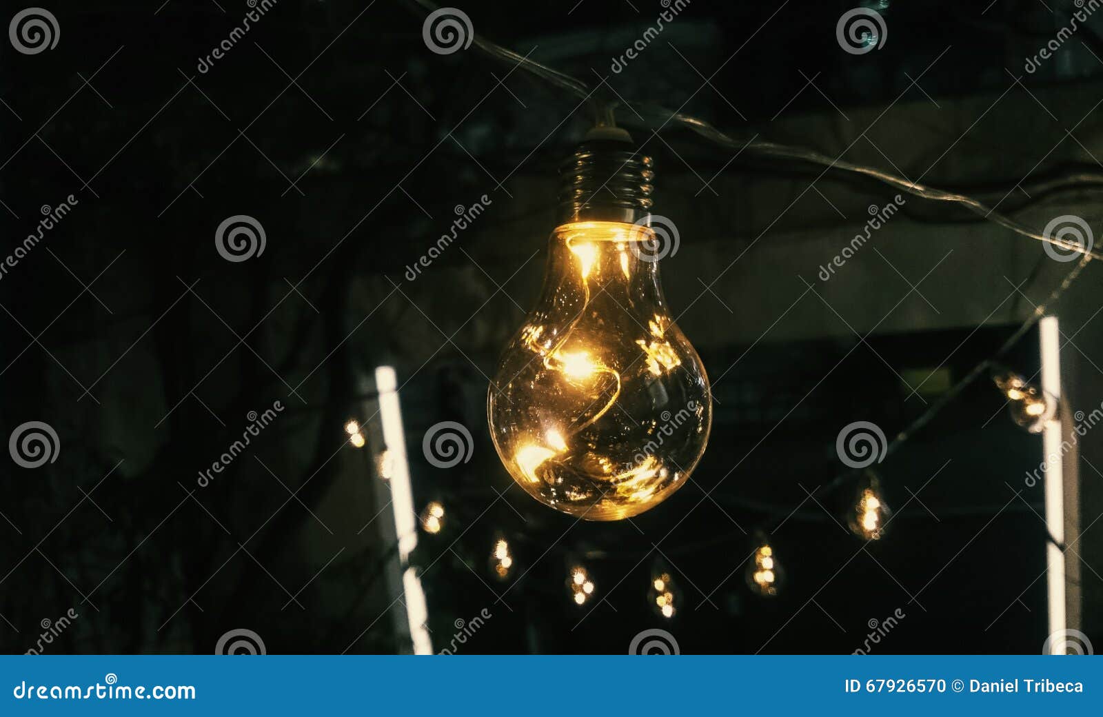 Festive Light Bulb at Night Stock Photo - Image of night, glowing: 67926570