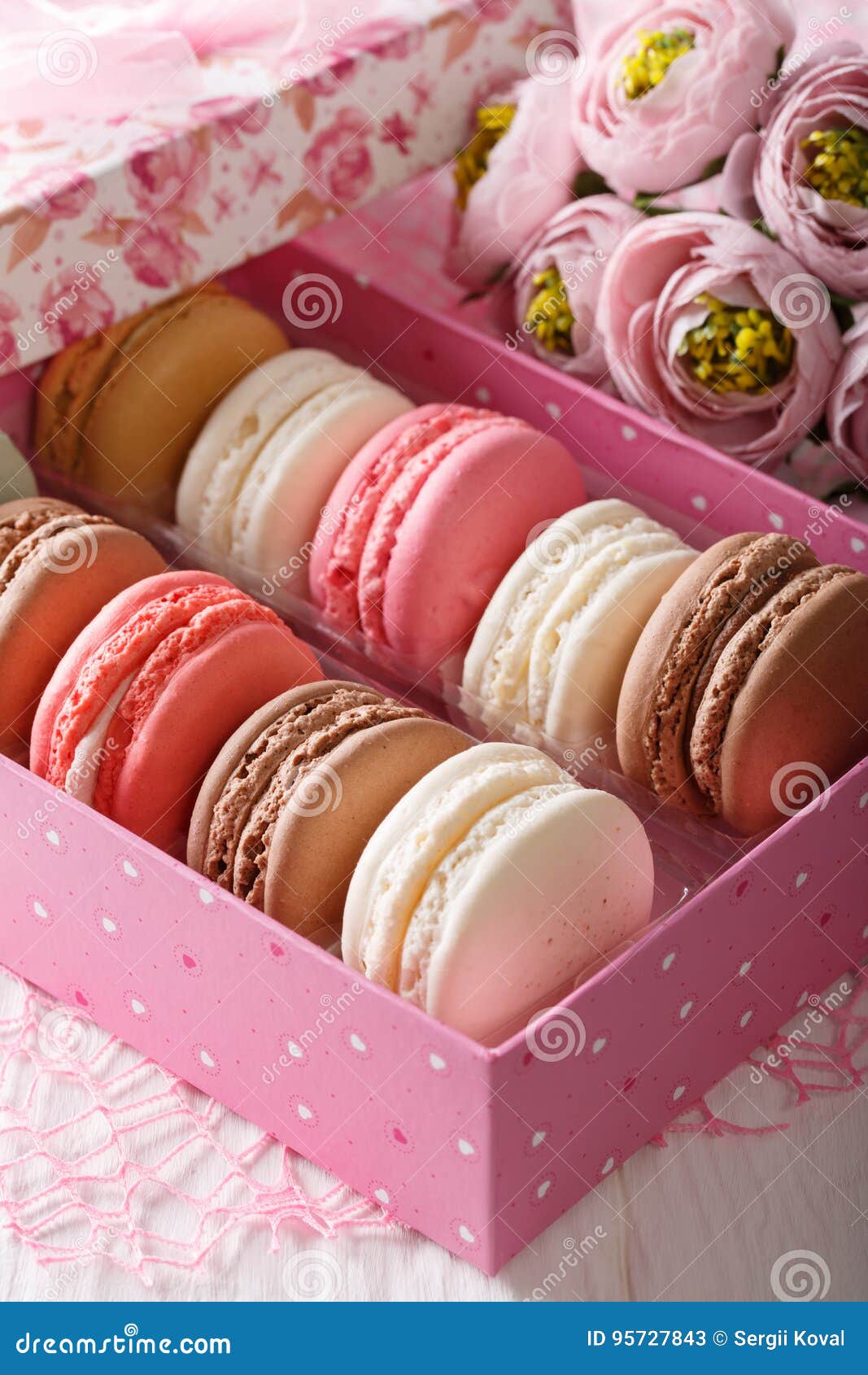 Festive Macaroons in a Gift Box and Flowers Close-up. Vertical Stock ...
