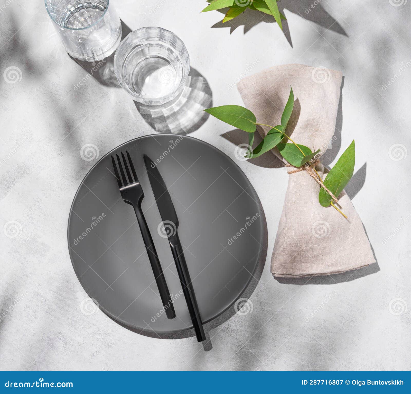 Festive Table Setting with Dark Grey Plate and Glasses for a ...