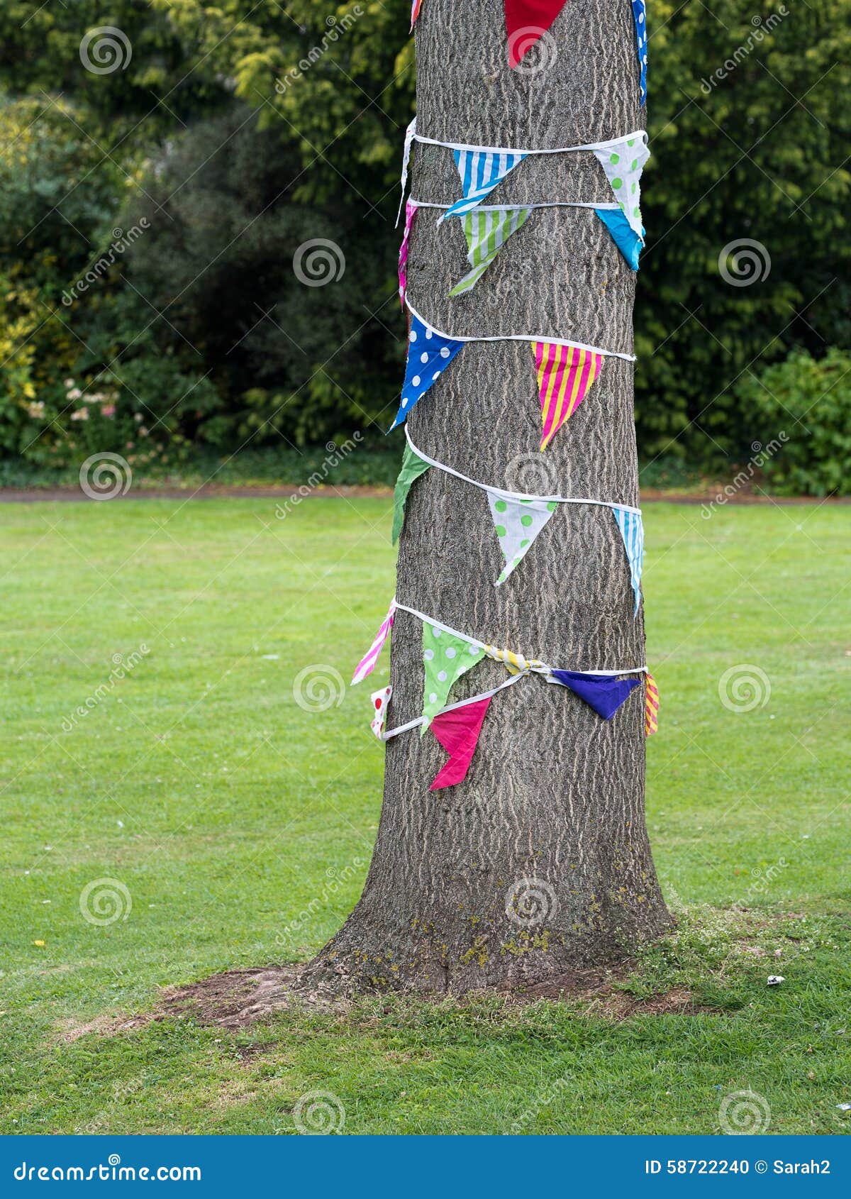 Festive Tree, Wrapped in Bunting, in Park. Stock Photo - Image of ...
