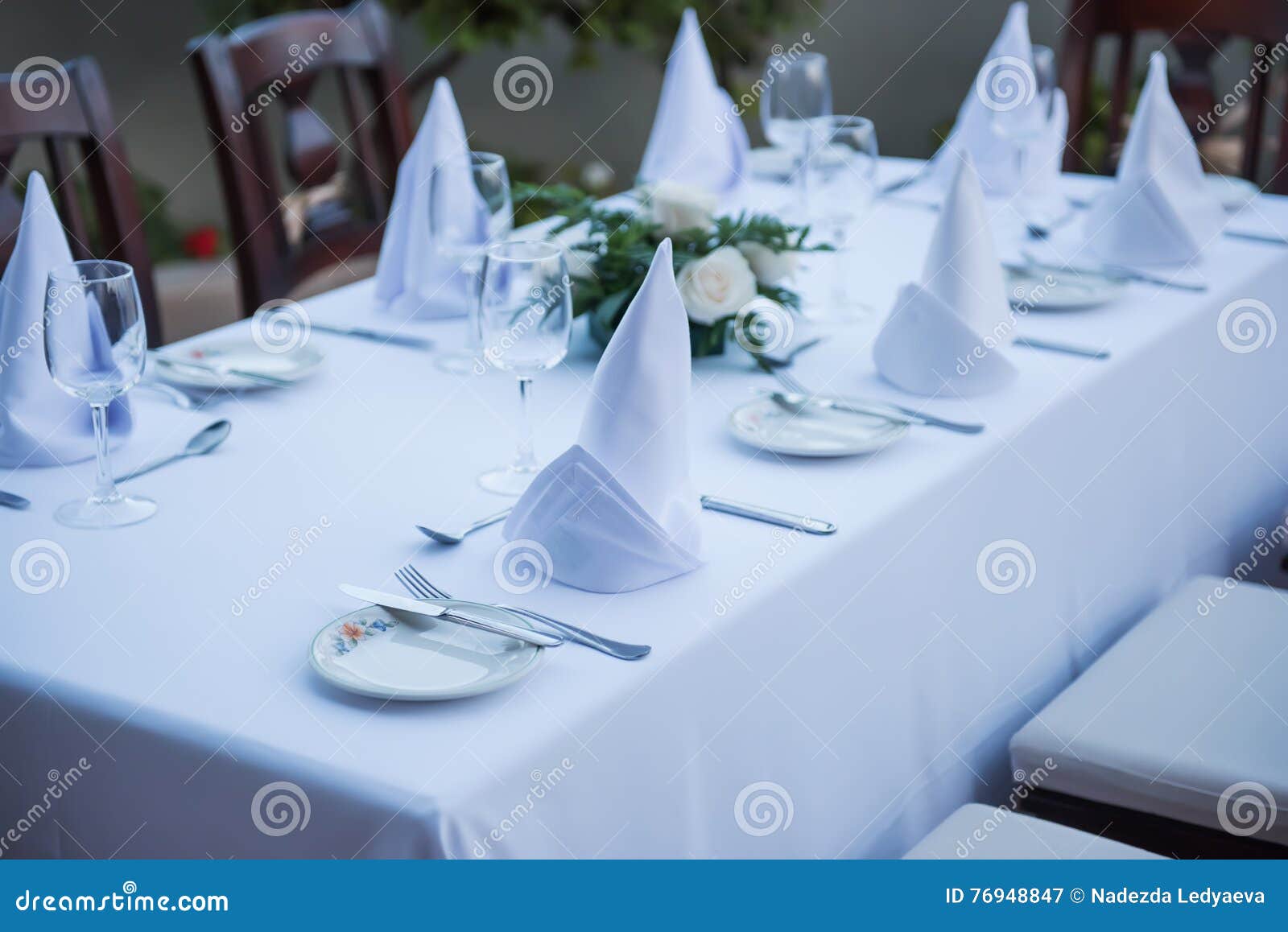 Festively Laid Table with White Tablecloths Glasses and Plates Stock ...