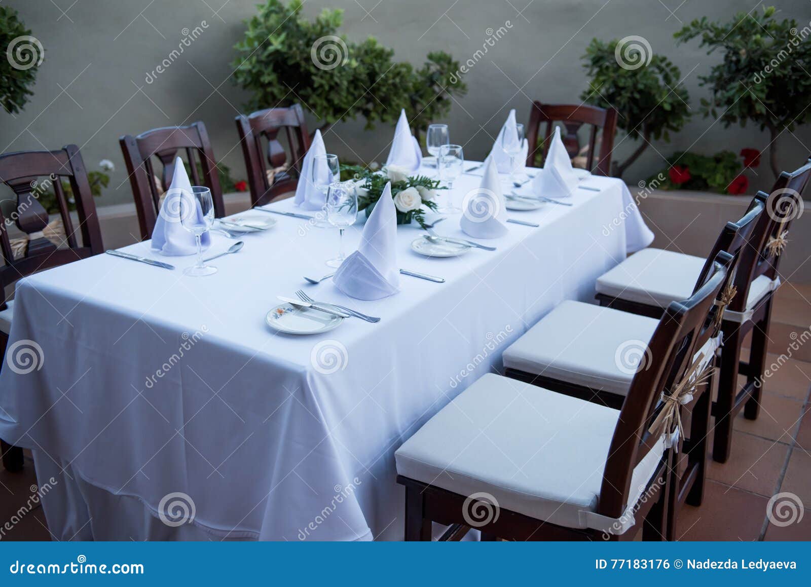 Festively Laid Table with White Tablecloths Glasses and Plates Stock ...