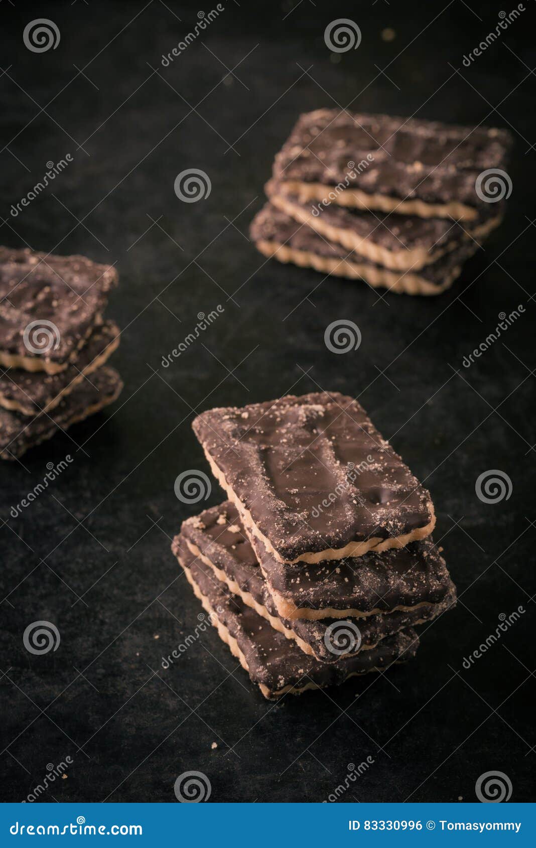 Few Chocolate Biscuits in Stack on Dark Tray Stock Photo - Image of ...