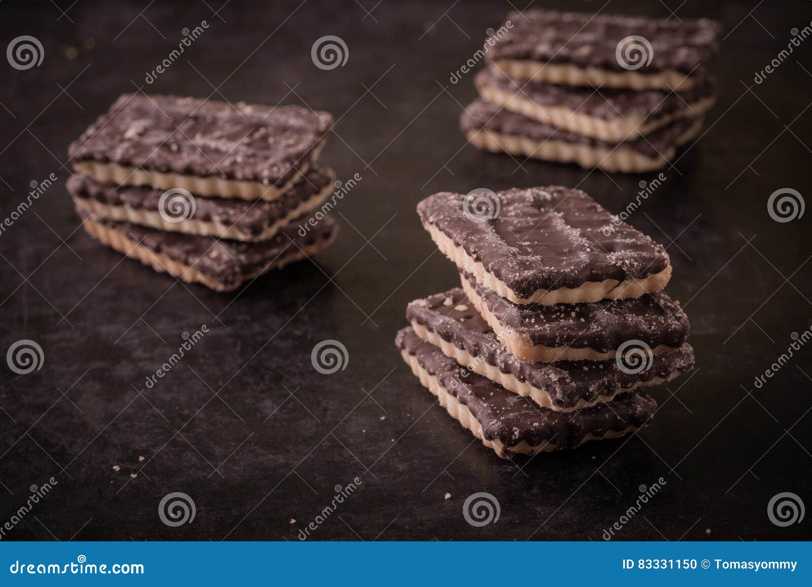 Few Chocolate Biscuits in Three Stacks on Dark Tray Stock Photo - Image ...