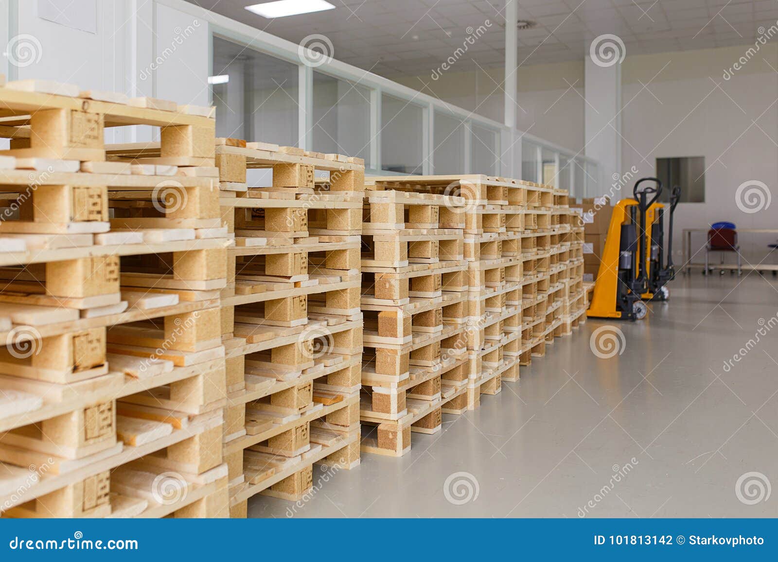 Few Empty Wooden Pallets for Storage in an Empty Warehouse. Stock Photo ...