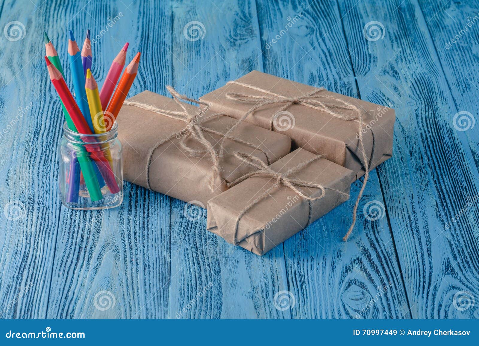 Few Gift Boxes and Colour Pencils in Jar on Table Stock Image - Image ...