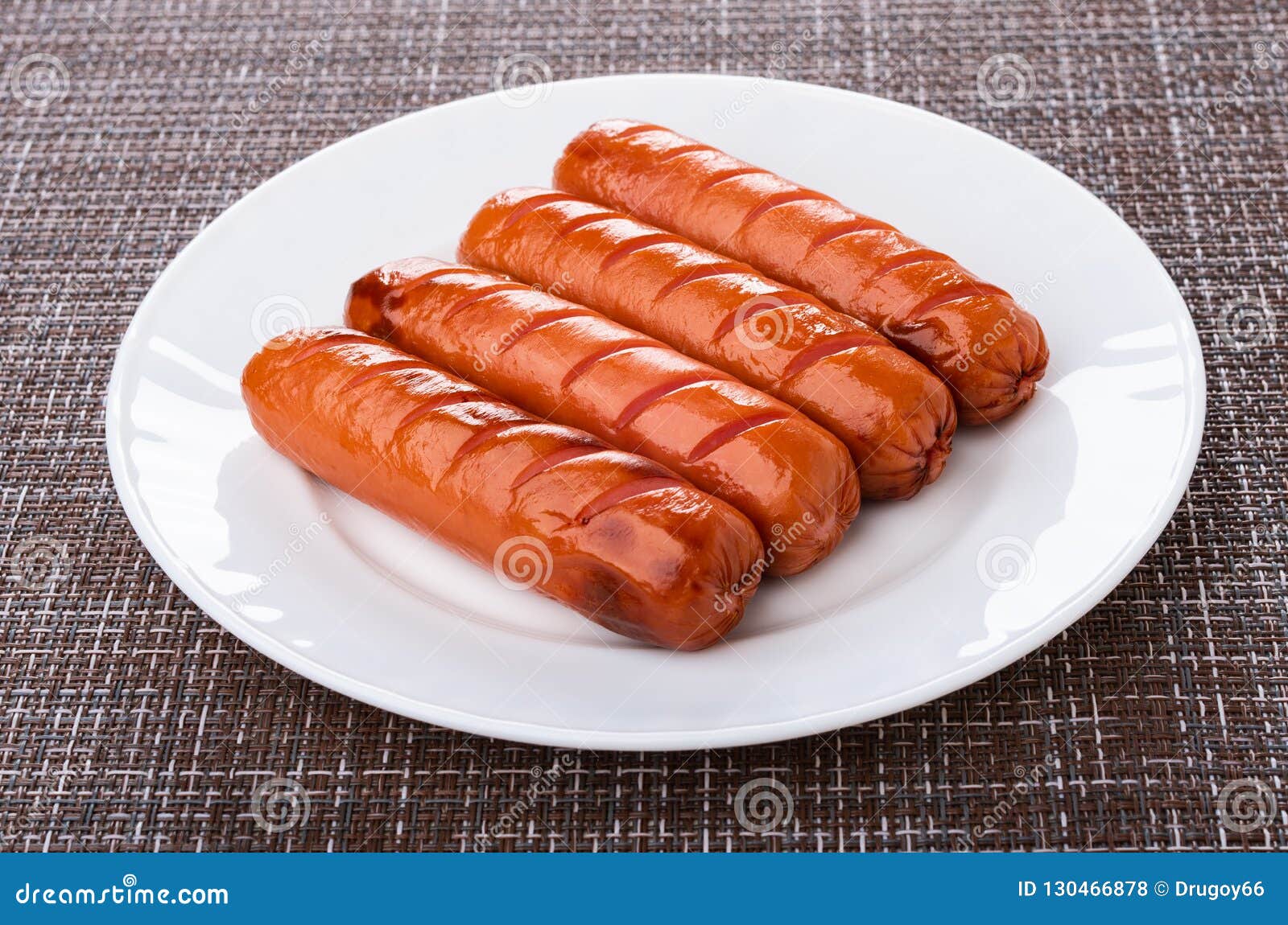 Few Grilled Sausages in Plate on Mat Stock Photo - Image of sausage ...