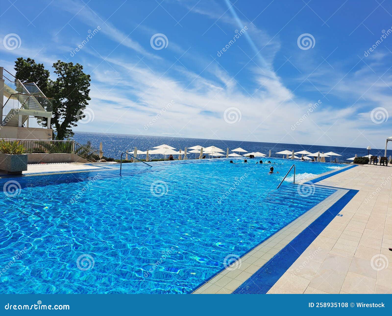 Few People Swimming in the Swimming Pool with a Seascape View in the ...