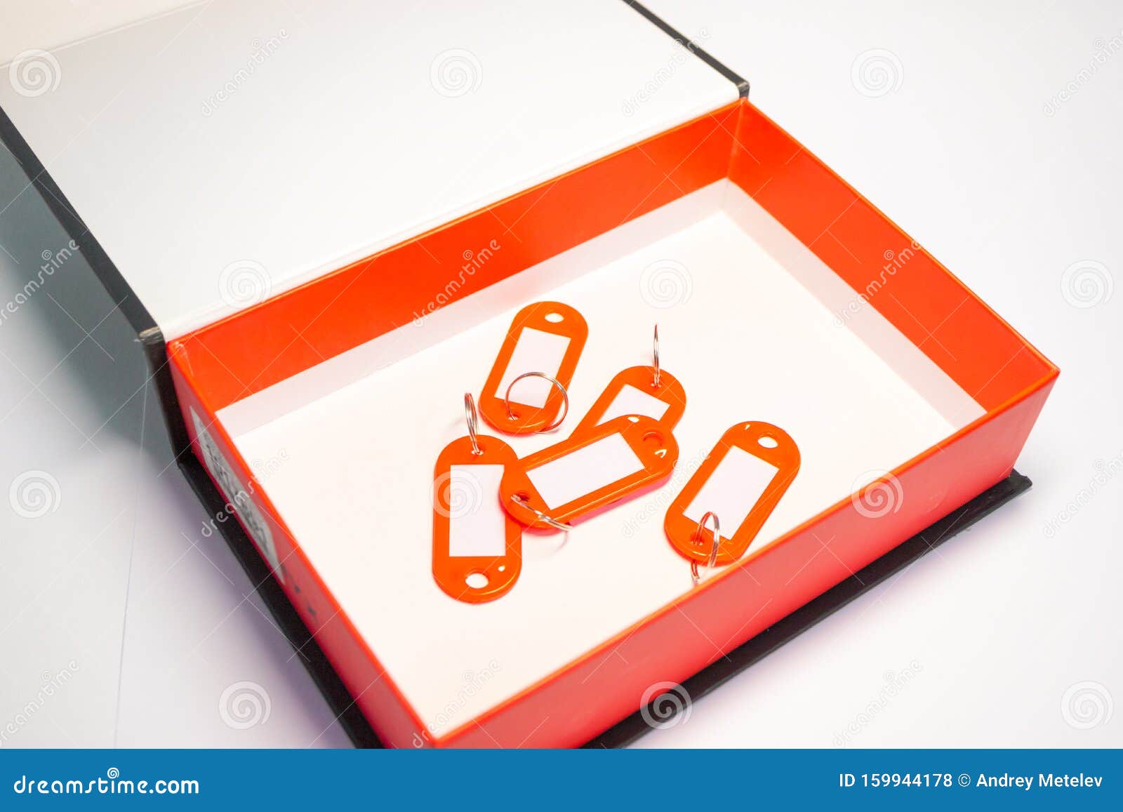 A Few Red Plastic Labels for Numbering the Keys in a Box with Red Edges ...