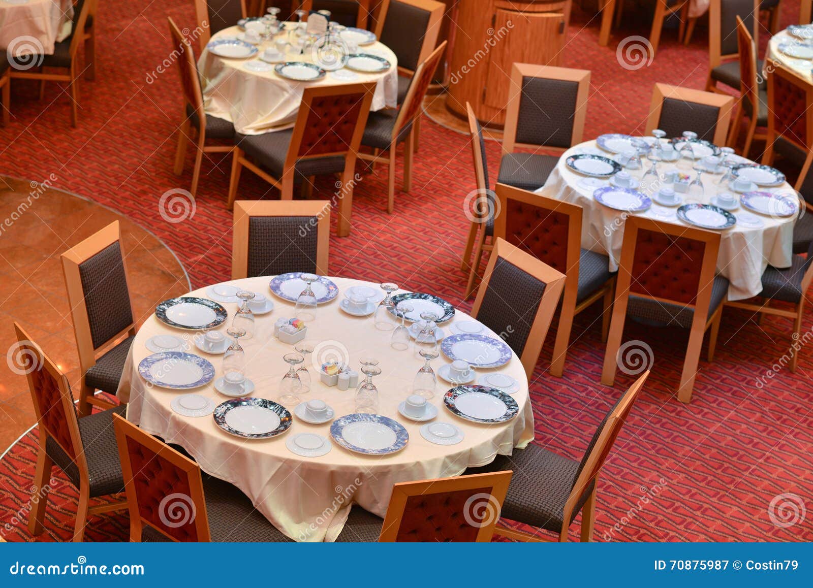 Few tables in dining room stock image. Image of design - 70875987