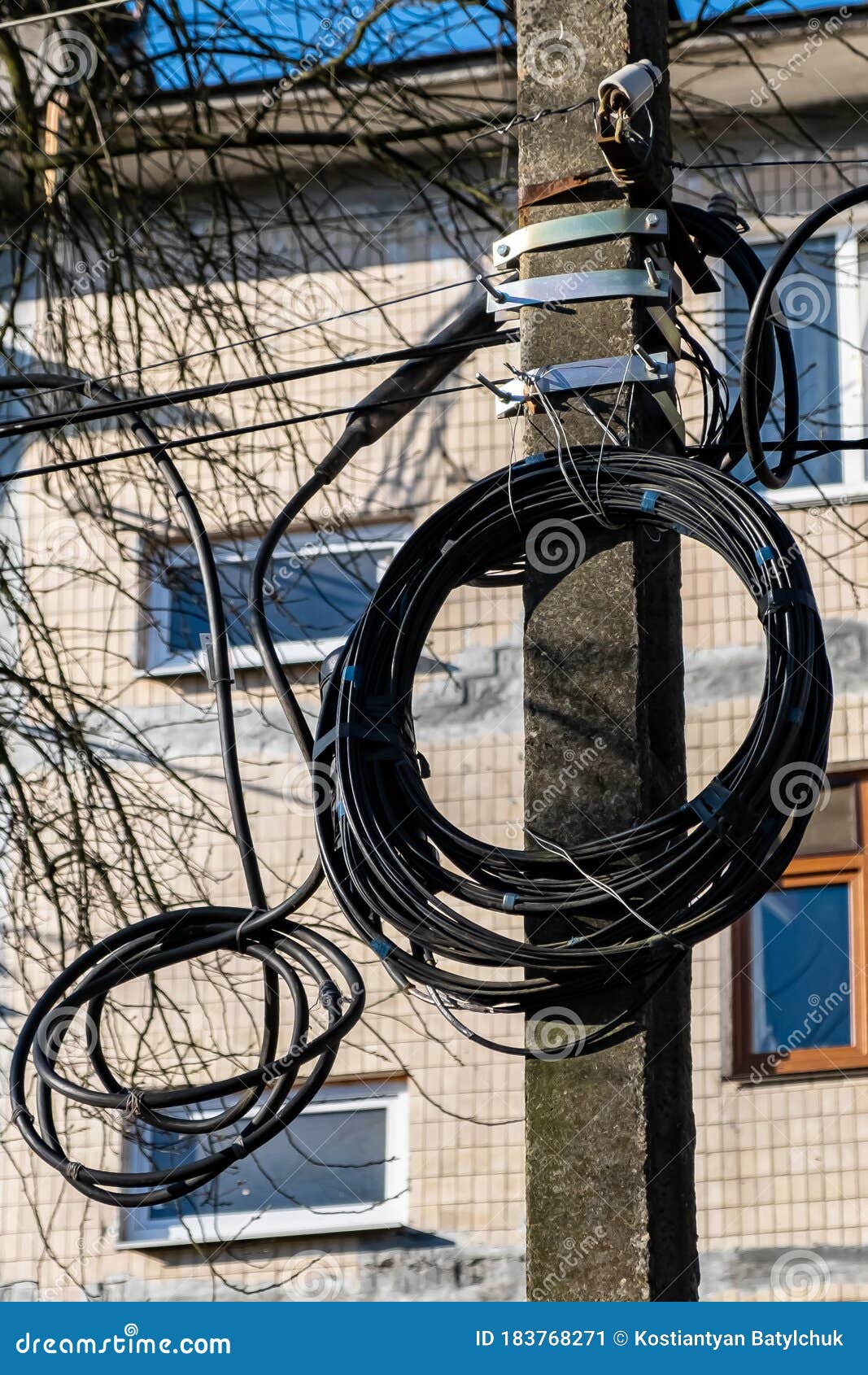 A Fiber Optic Cable Harness for Communication Weighs on a Concrete ...