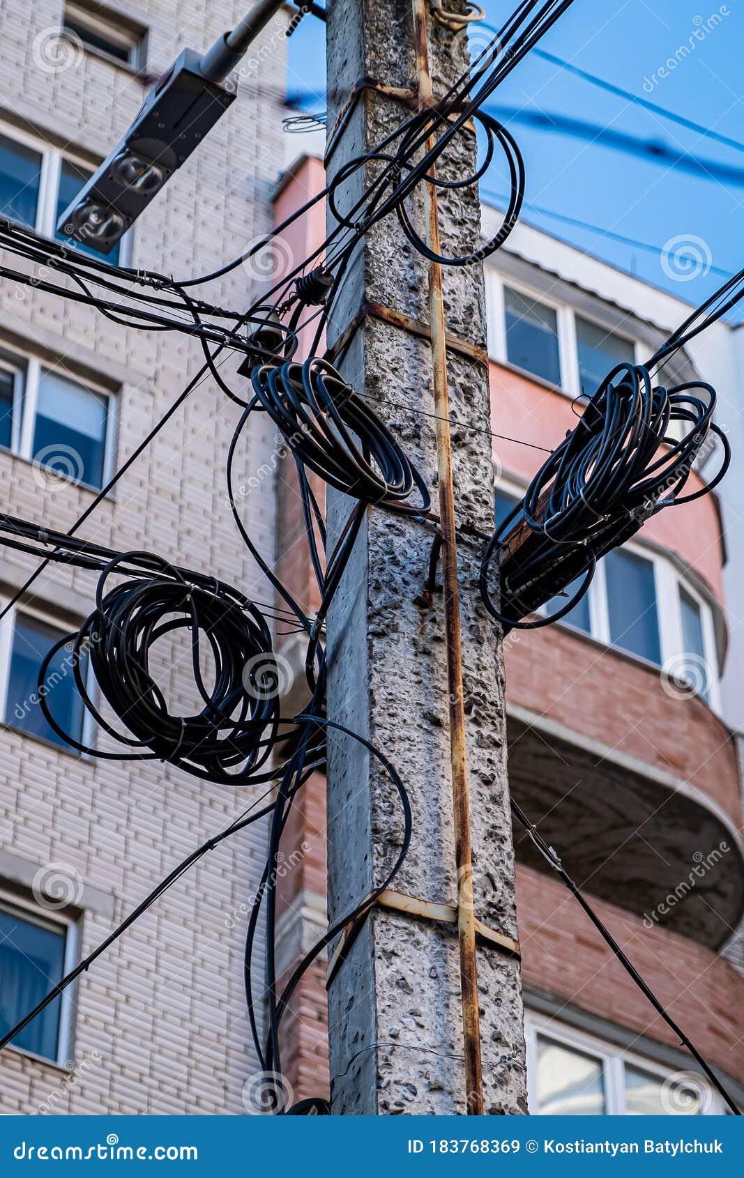 A Fiber Optic Cable Harness for Communication Weighs on a Concrete ...