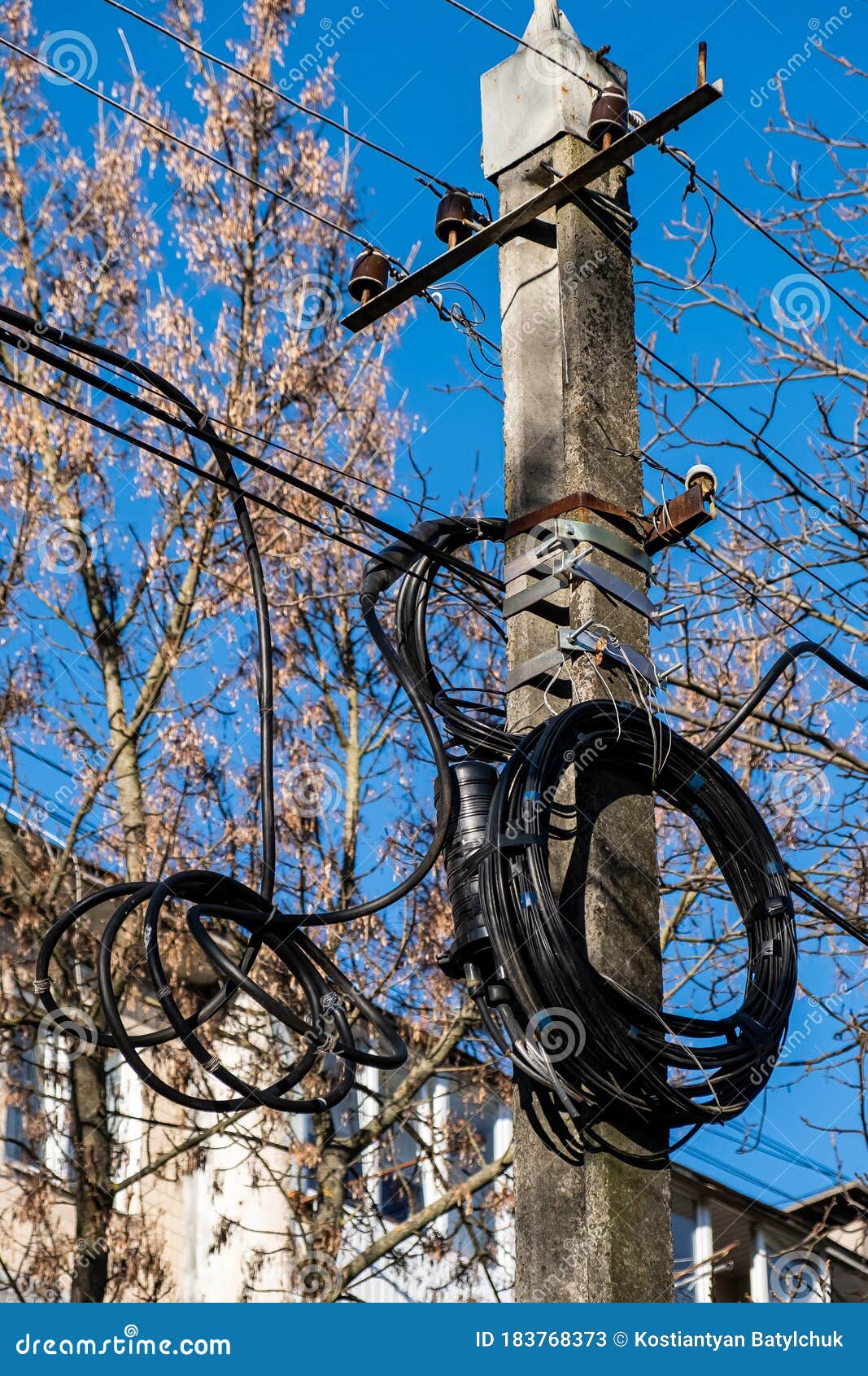 A Fiber Optic Cable Harness for Communication Weighs on a Concrete ...