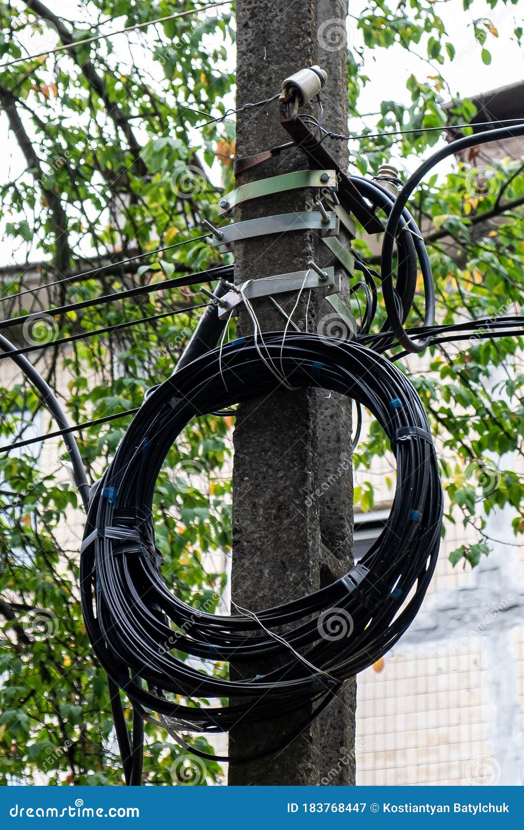 A Fiber Optic Cable Harness for Communication Weighs on a Concrete ...