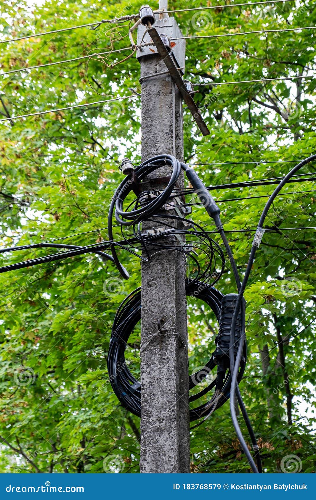 A Fiber Optic Cable Harness for Communication Weighs on a Concrete ...
