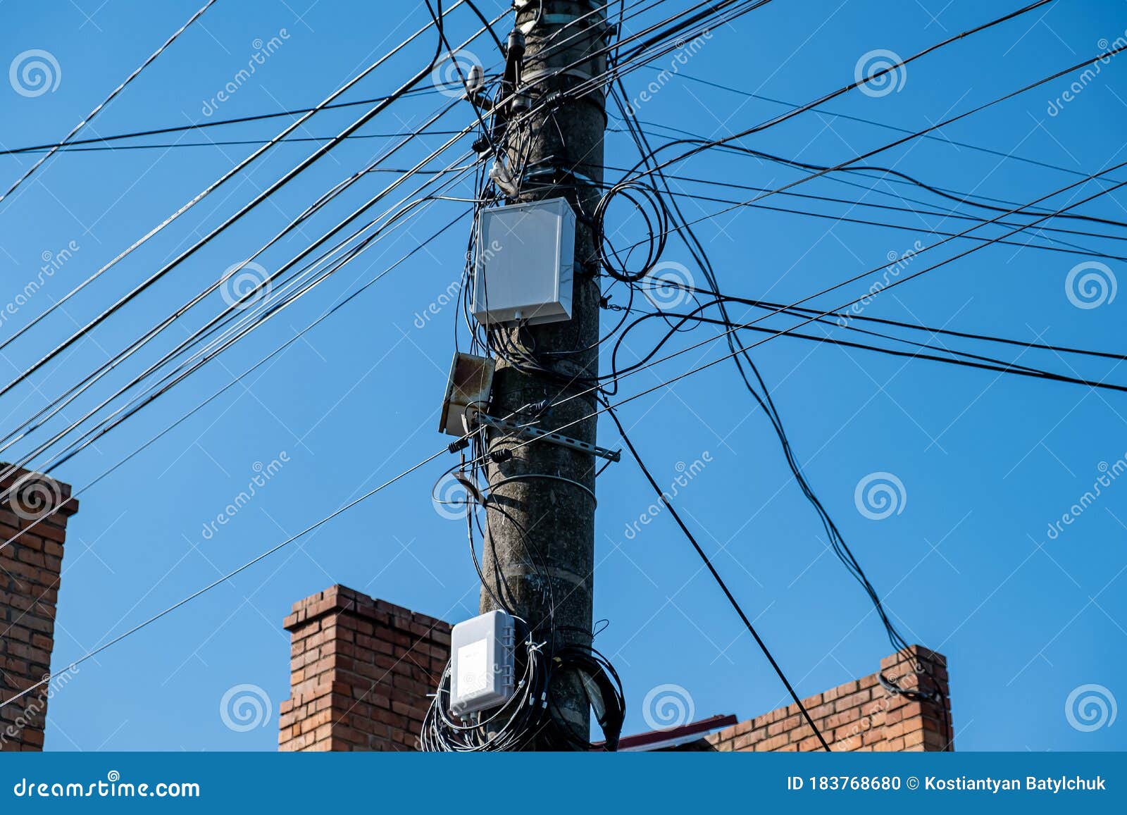 A Fiber Optic Cable Harness for Communication Weighs on a Concrete ...