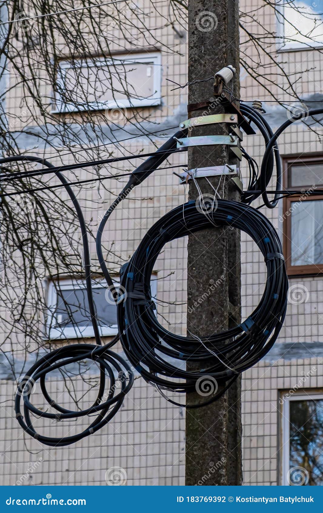 A Fiber Optic Cable Harness for Communication Weighs on a Concrete ...