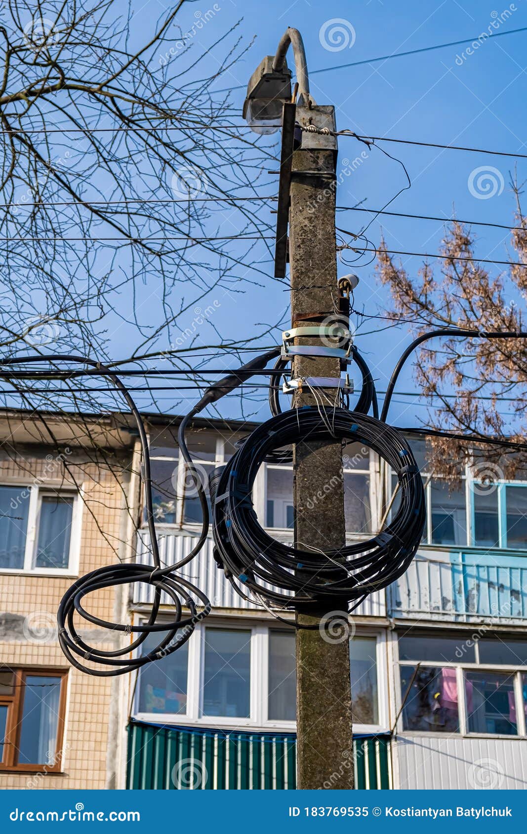 A Fiber Optic Cable Harness for Communication Weighs on a Concrete ...