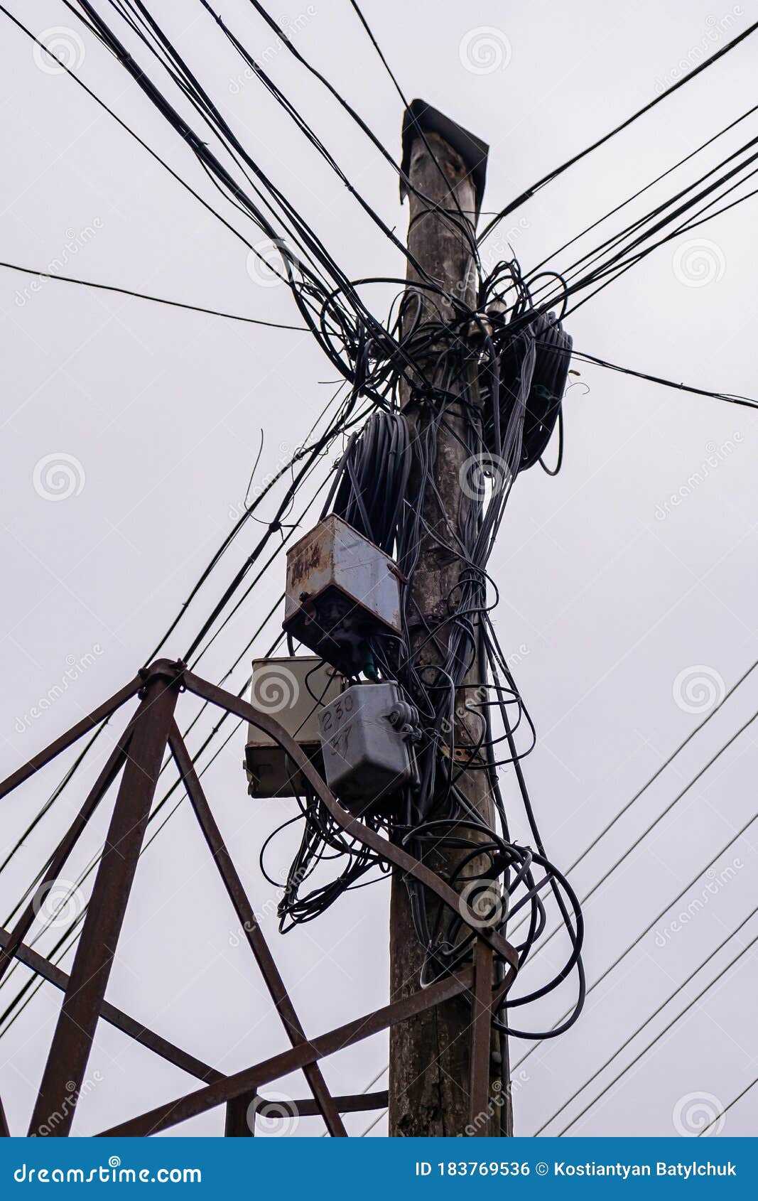A Fiber Optic Cable Harness for Communication Weighs on a Concrete ...