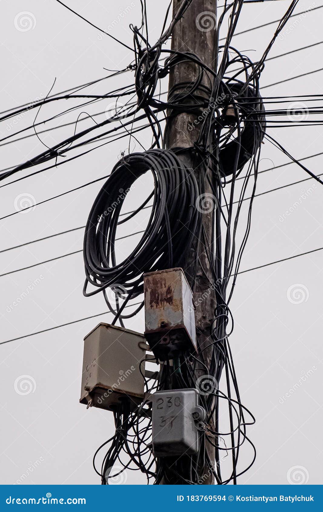 A Fiber Optic Cable Harness for Communication Weighs on a Concrete ...