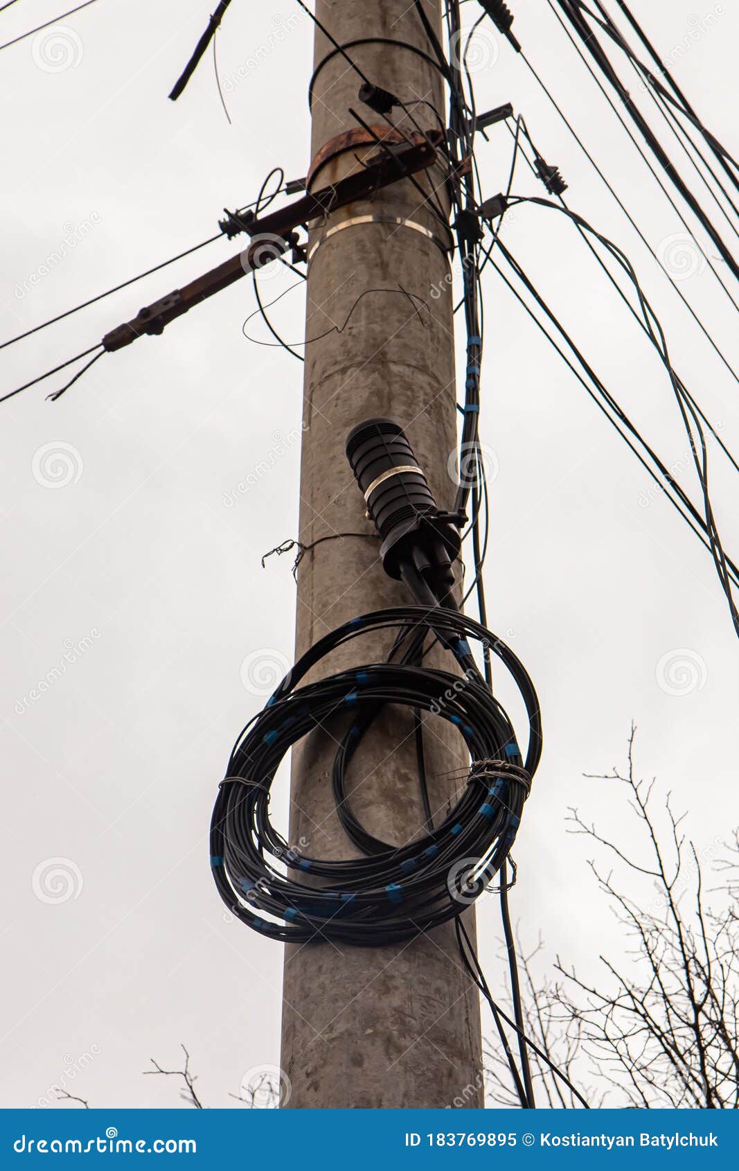 A Fiber Optic Cable Harness for Communication Weighs on a Concrete ...