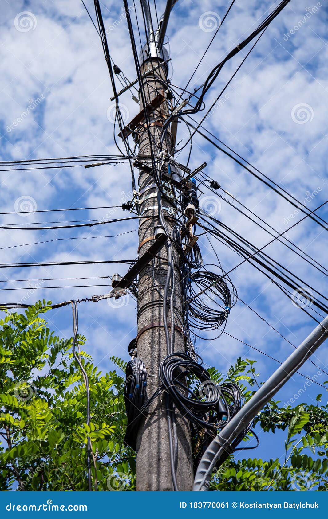 A Fiber Optic Cable Harness for Communication Weighs on a Concrete ...