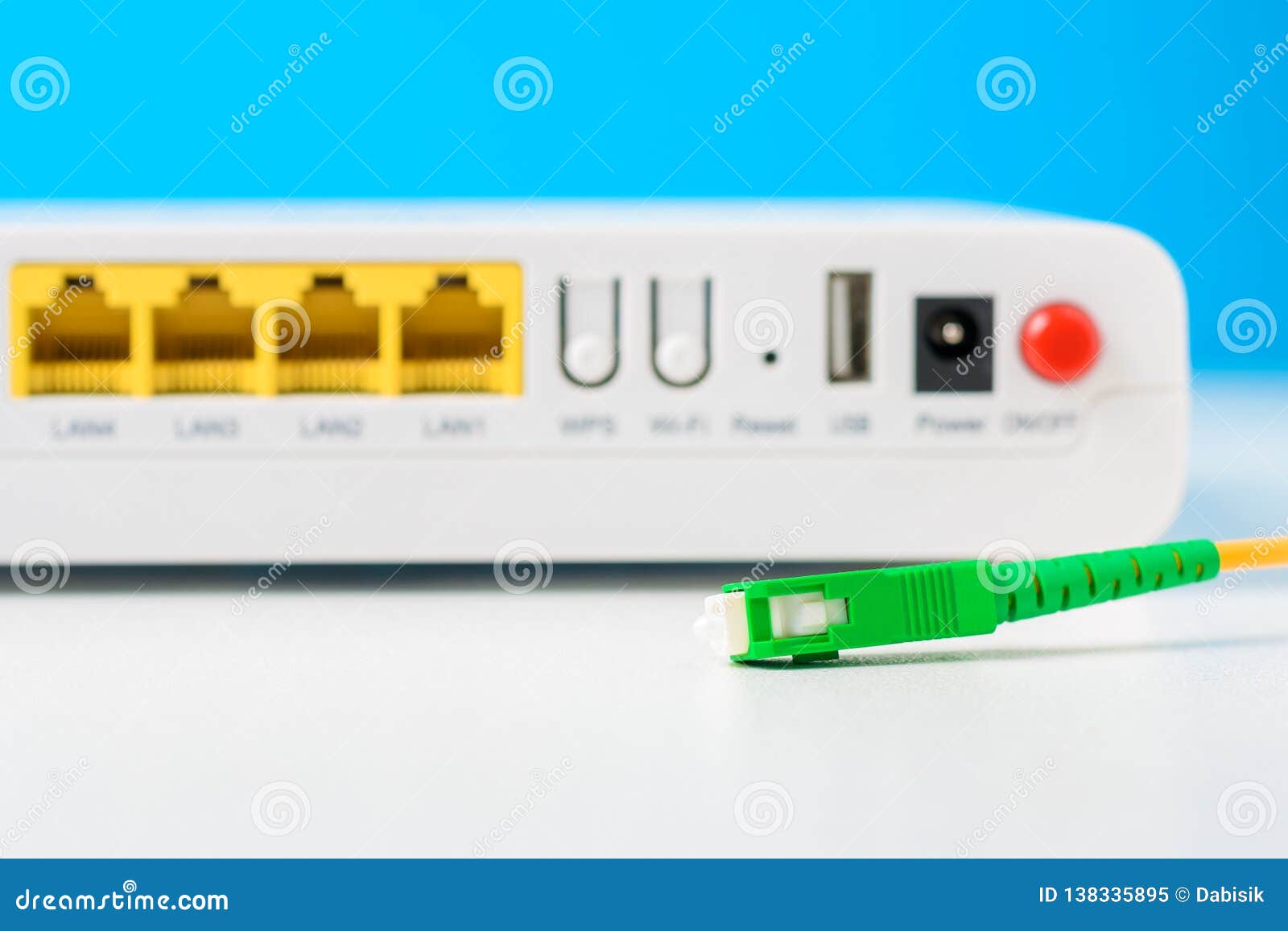 Fiber Optical Cable and Internet Wireless Router on a Blue Background ...