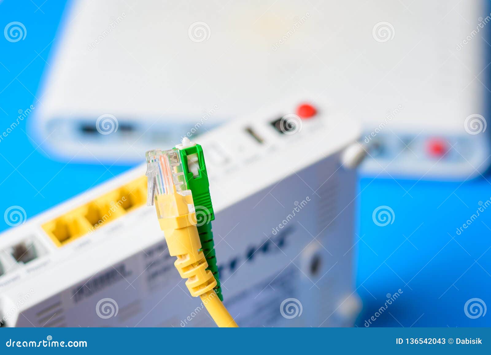 Fiber Optical and Network Cables with Internet Wireless Router on a ...