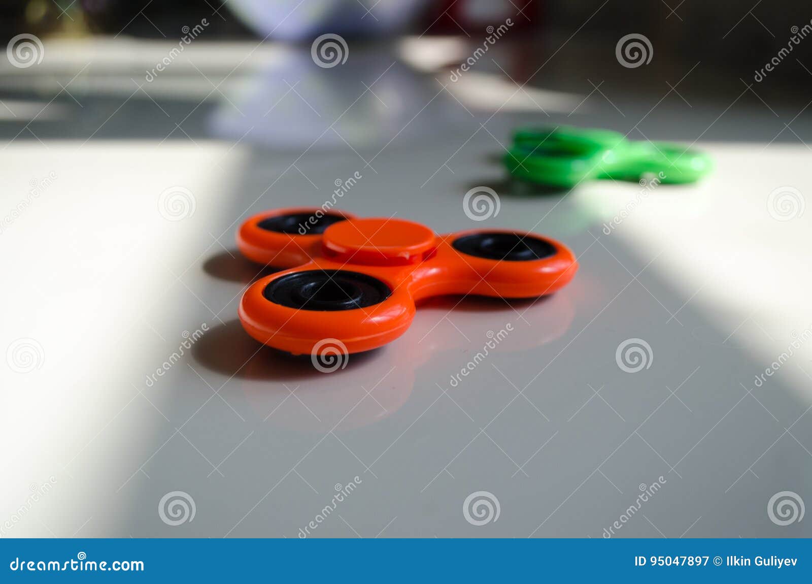 Fidget Finger Spinner Stress, Anxiety Relief Toy on Table Stock Image ...