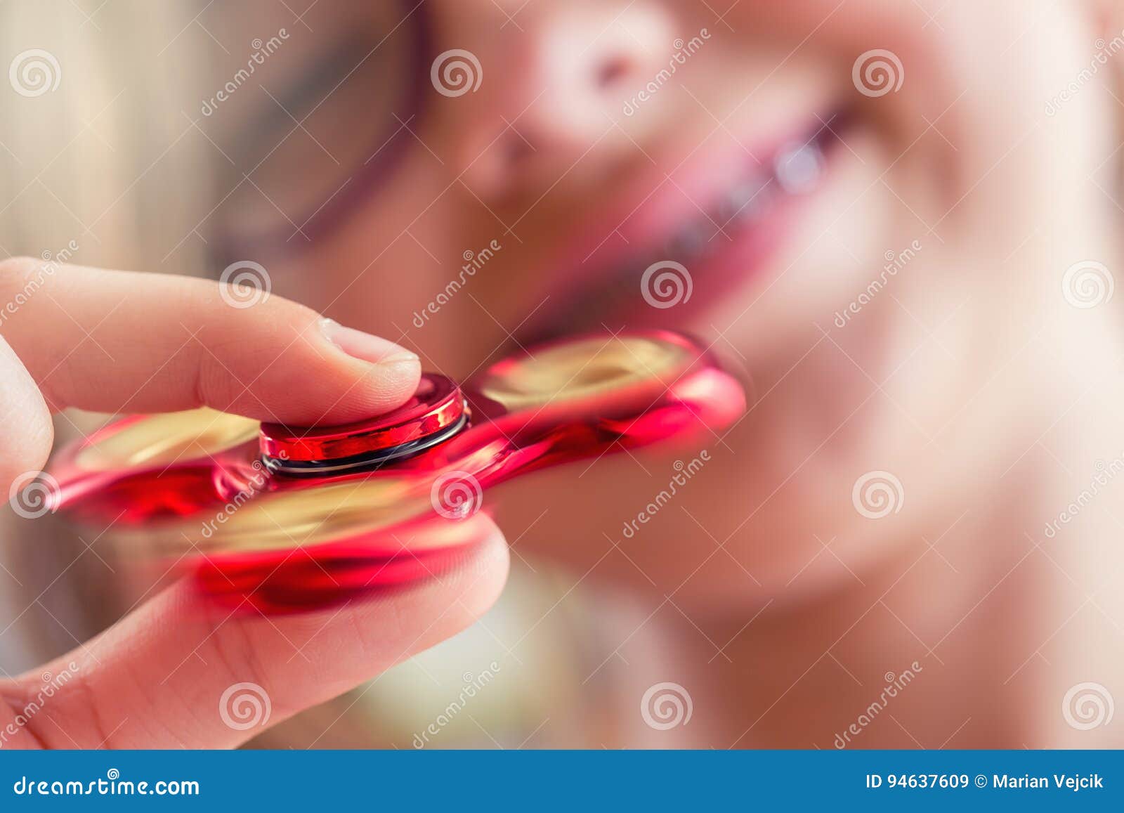 Fidget Spinner. Cute Young Girl Playing with Fidget Spinner Stock Image ...