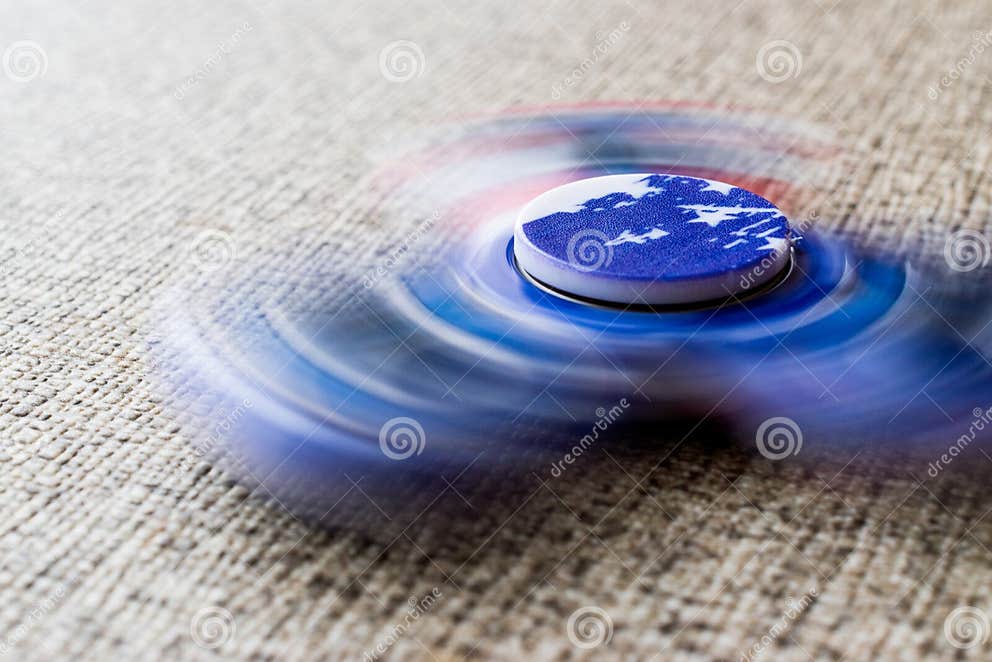 Fidget Spinner on a Grey Surface. Stock Photo - Image of figet, energy ...