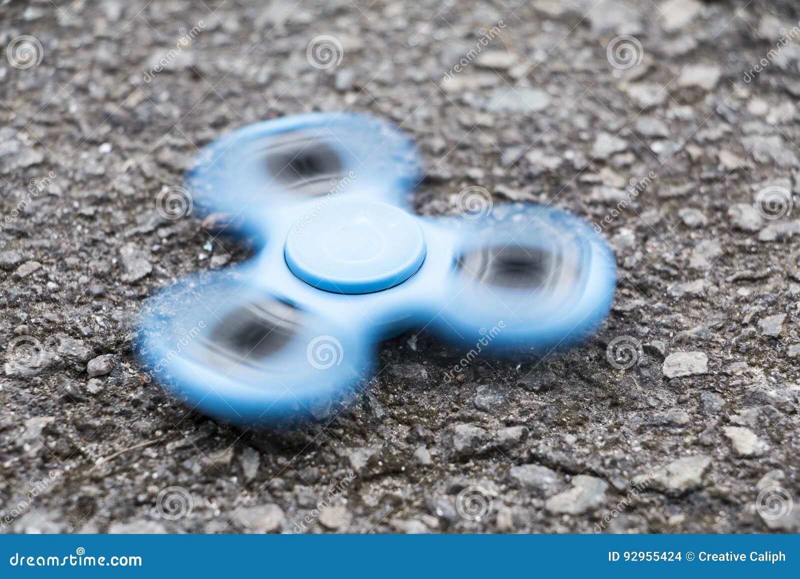 Fidget Spinner stock photo. Image of gold, road, rotating - 92955424
