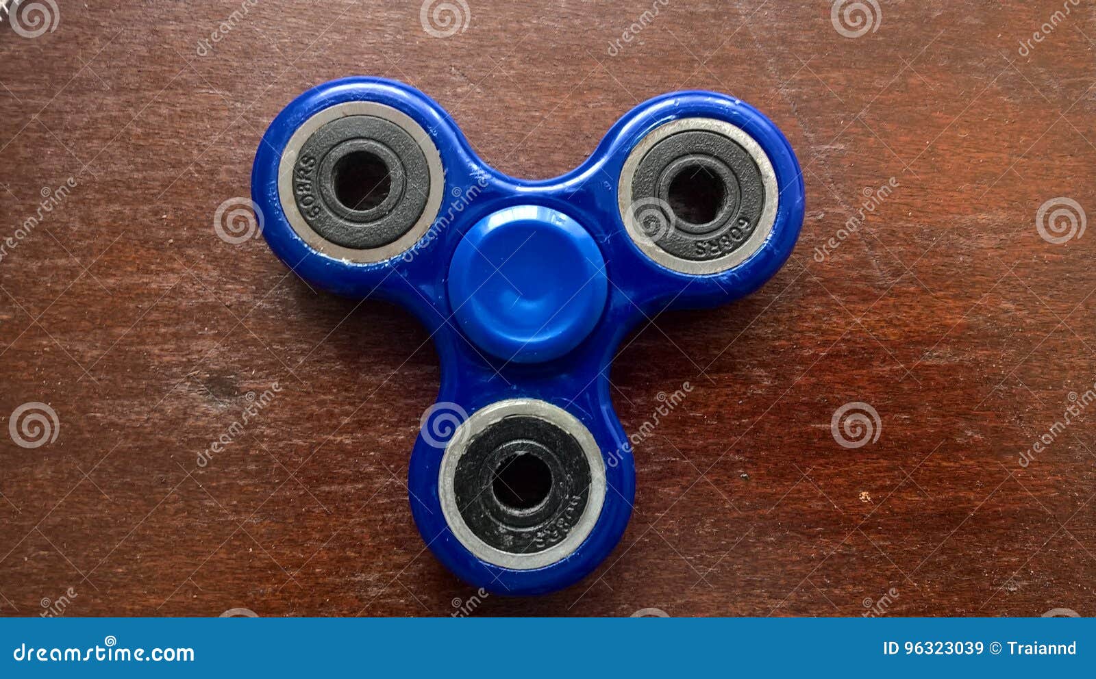 Fidget Spinner on a table stock image. Image of stress - 96323039
