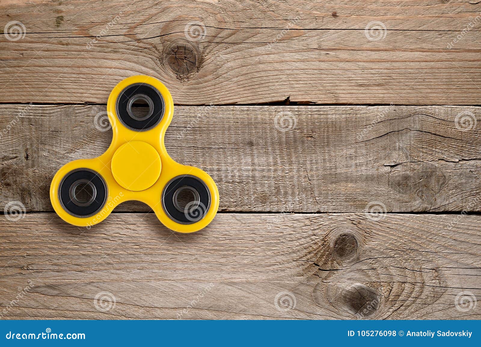 Fidget Spinner Toy on Table Stock Photo - Image of bearing, yellow ...