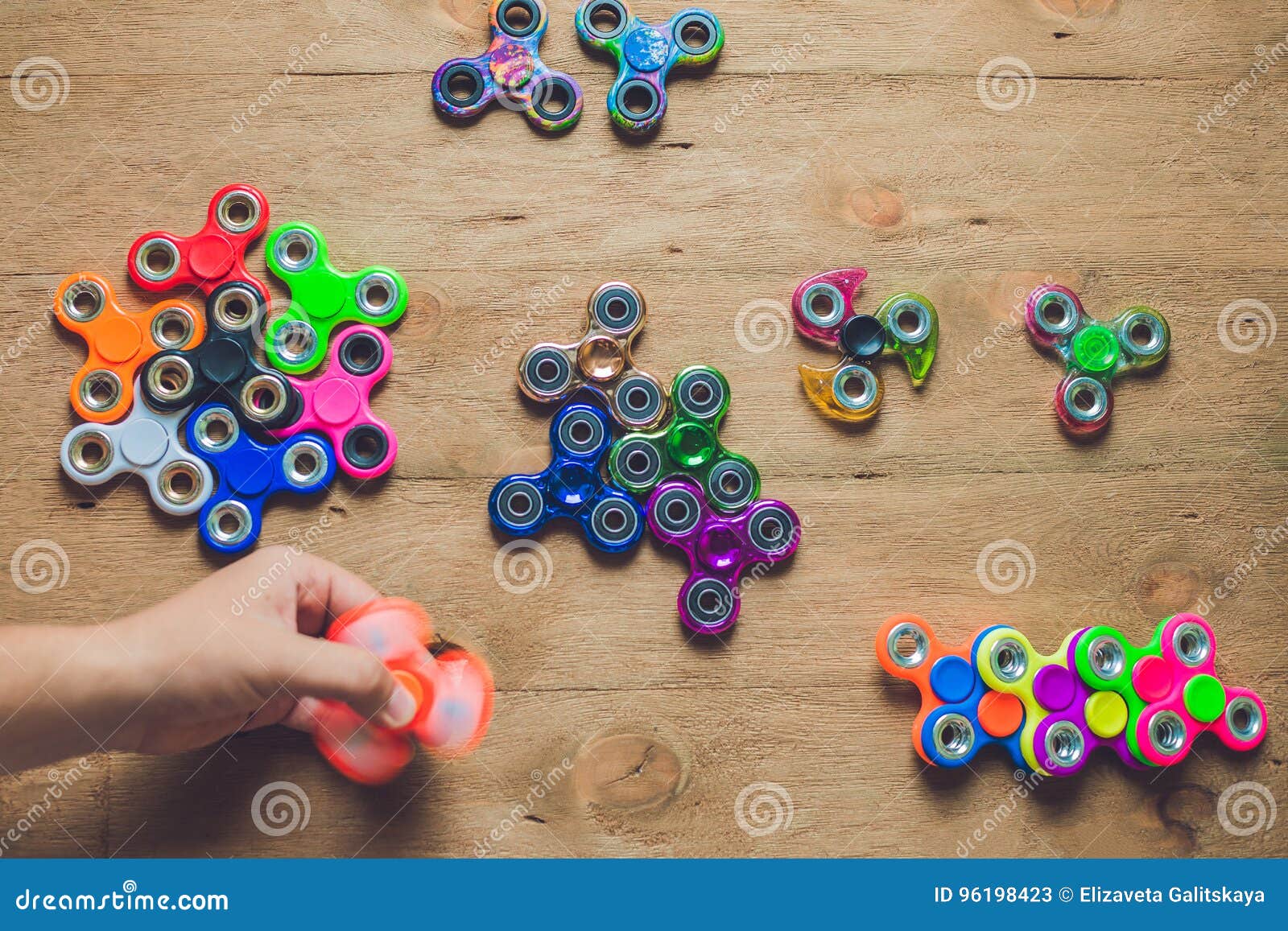 Fidget Spinners on Wooden Background with Copy Space, Popular Re Stock ...
