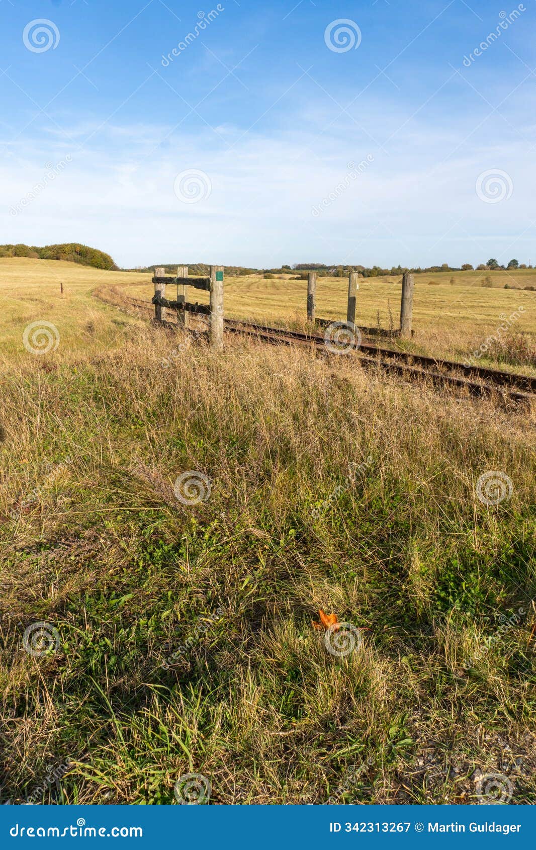 A Field with a Fence and a Train Track Stock Image - Image of meadow ...
