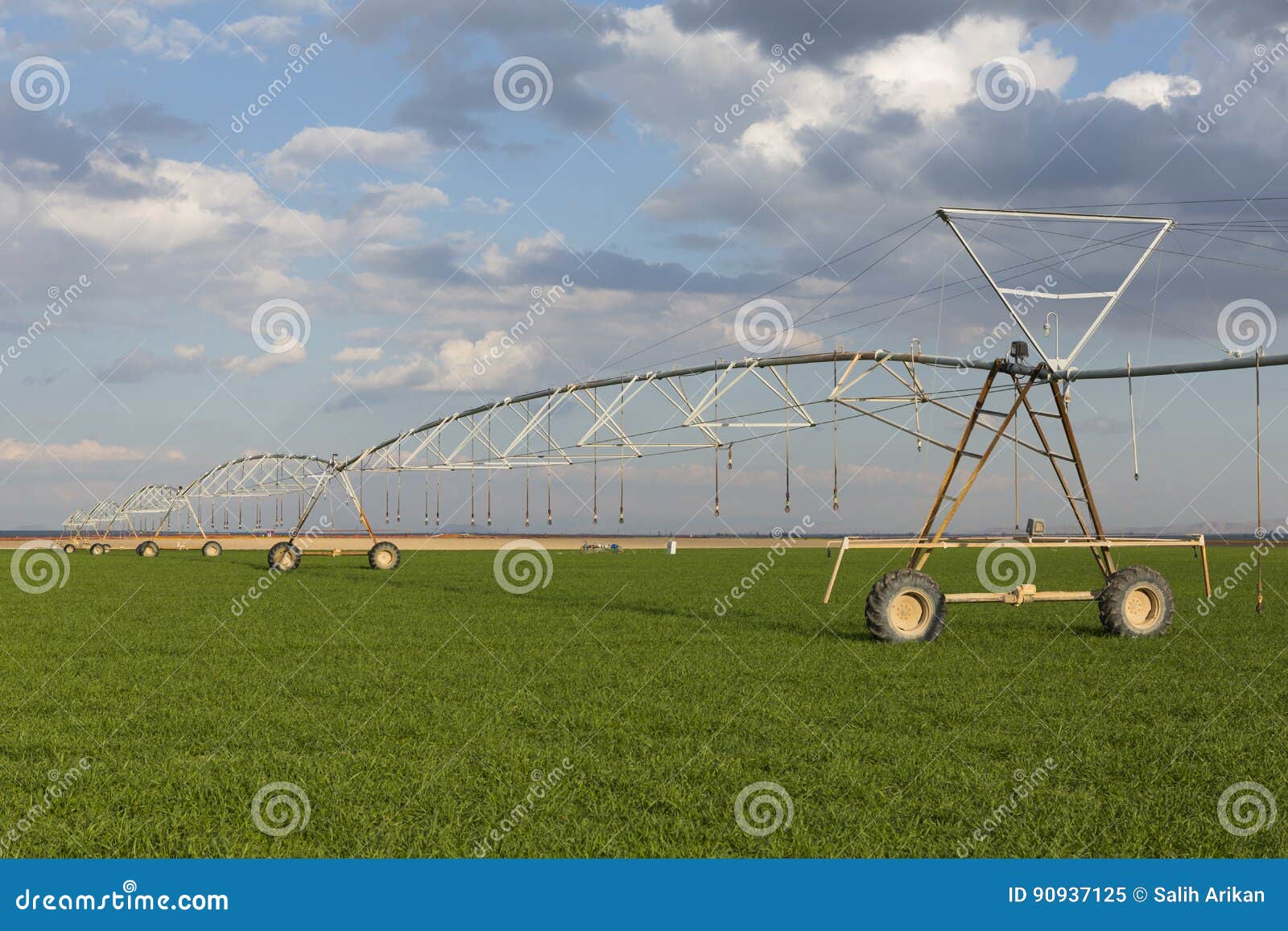 Field Irrigated by a Pivot Sprinkler System. Stock Image - Image of ...