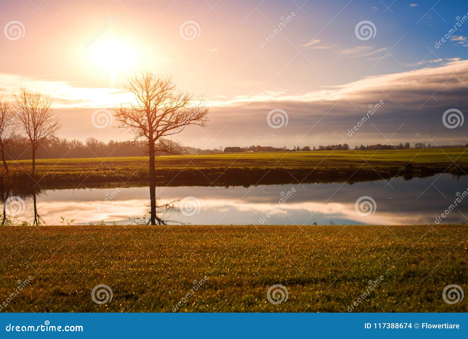 Field with Lake on Sunset in Latvia on Cloudy Sky and Sunset Background ...