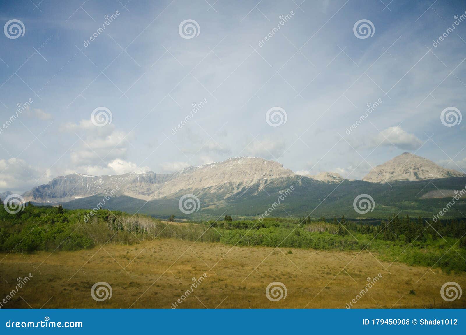 Field and mountains stock photo. Image of hills, slope - 179450908
