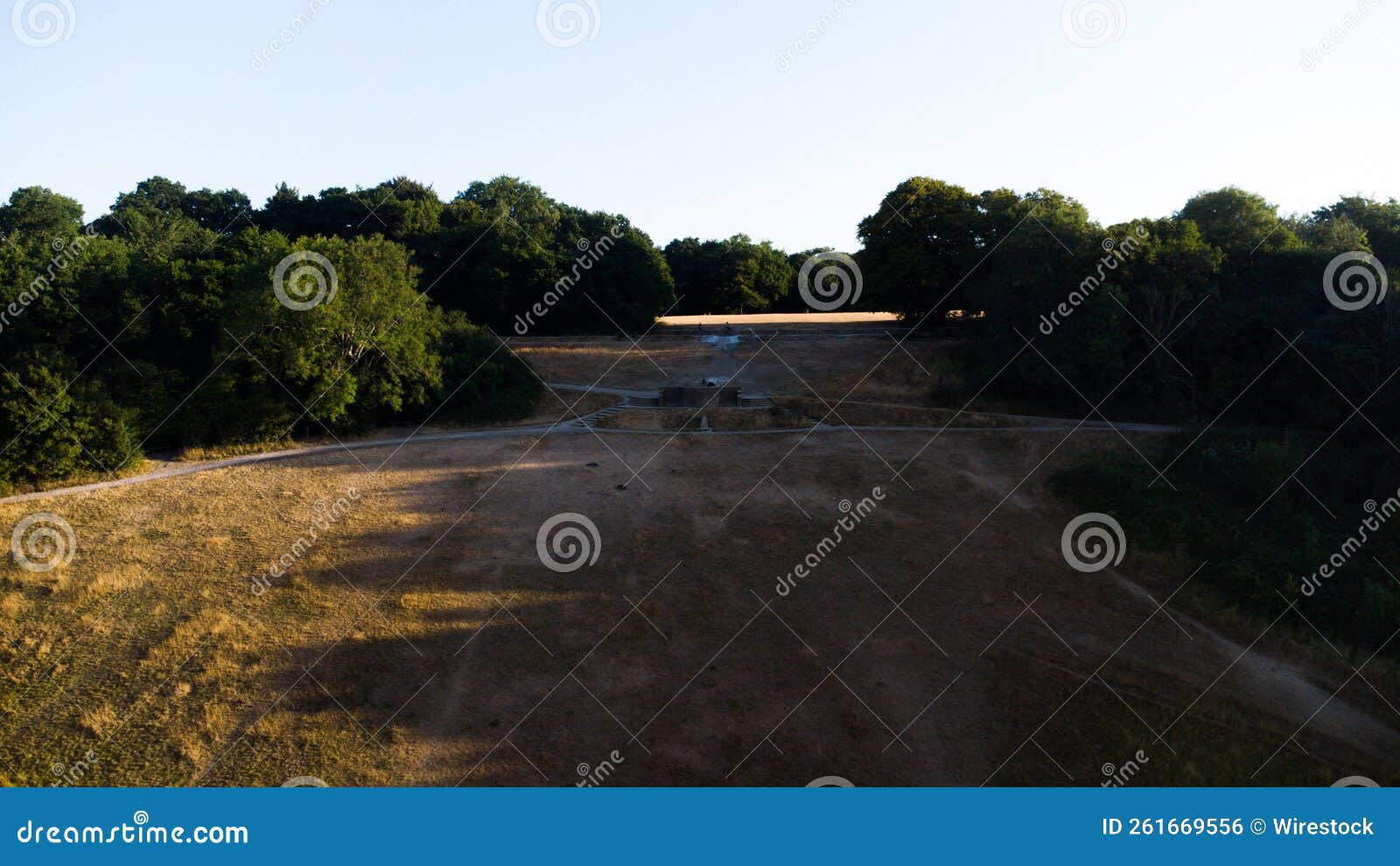 Field with Pits Around Green Trees Stock Photo - Image of valley ...
